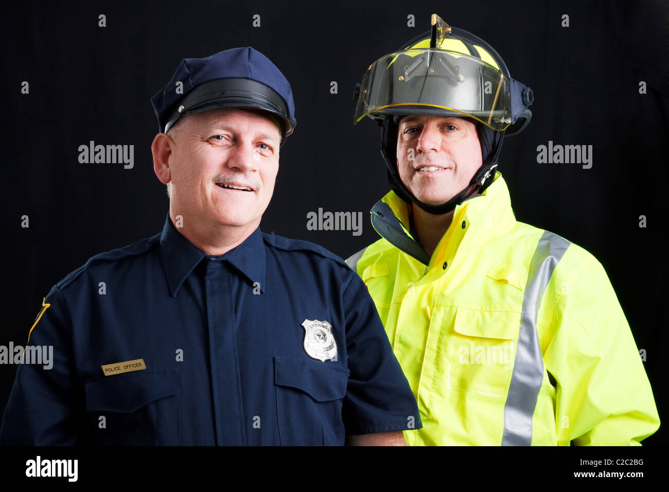 Public employees, a firefighter and a police officer, smiling and happy ...