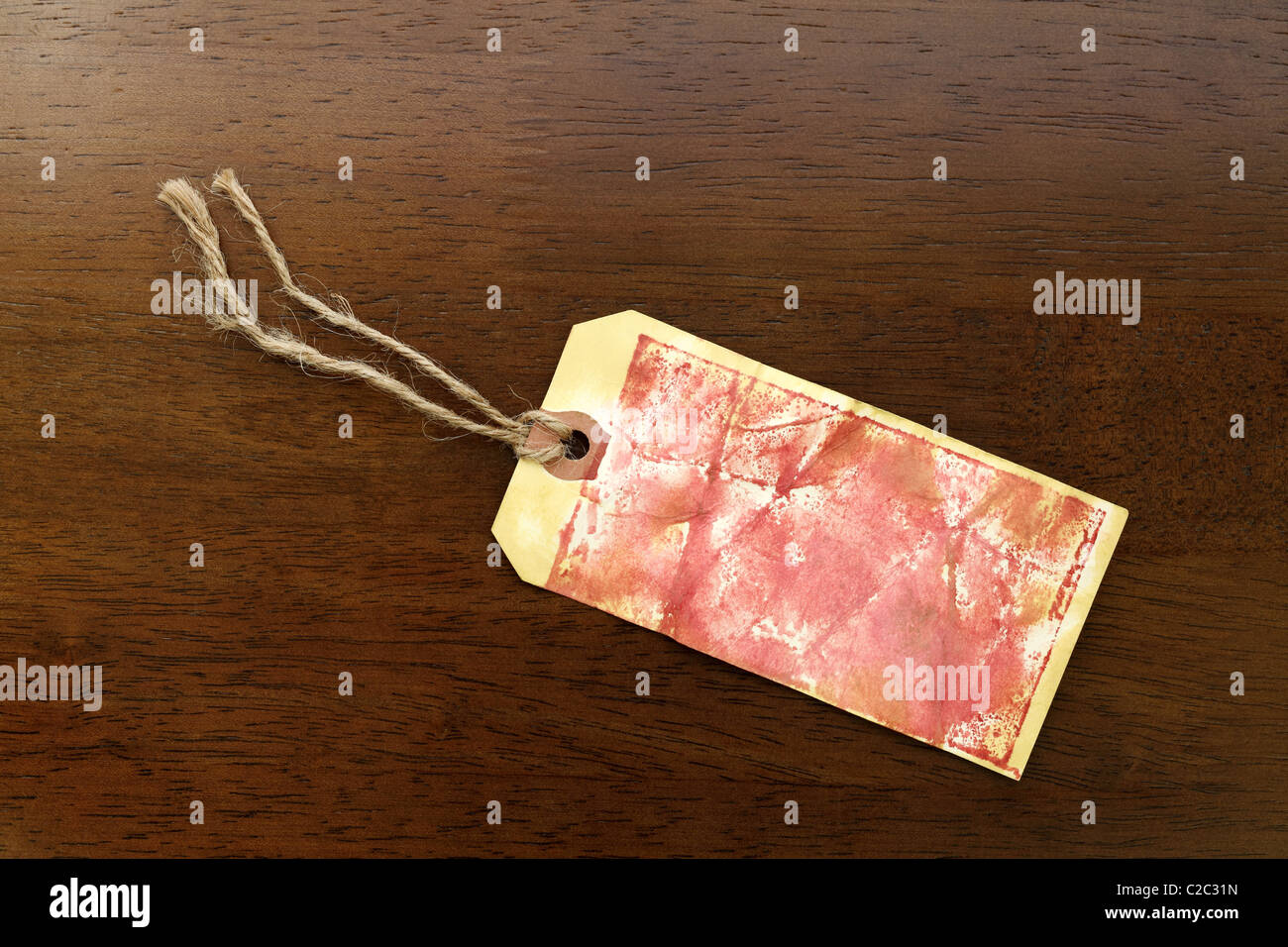 Old paper tag on wooden table Stock Photo - Alamy