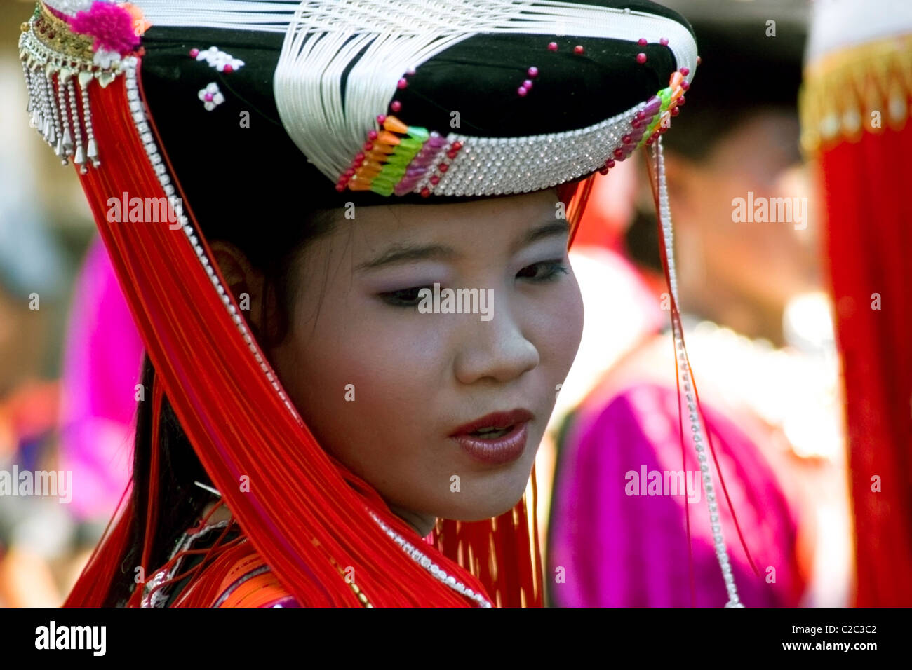 An ethnic Lisu women is attending a traditional dance ceremony in Pai ...