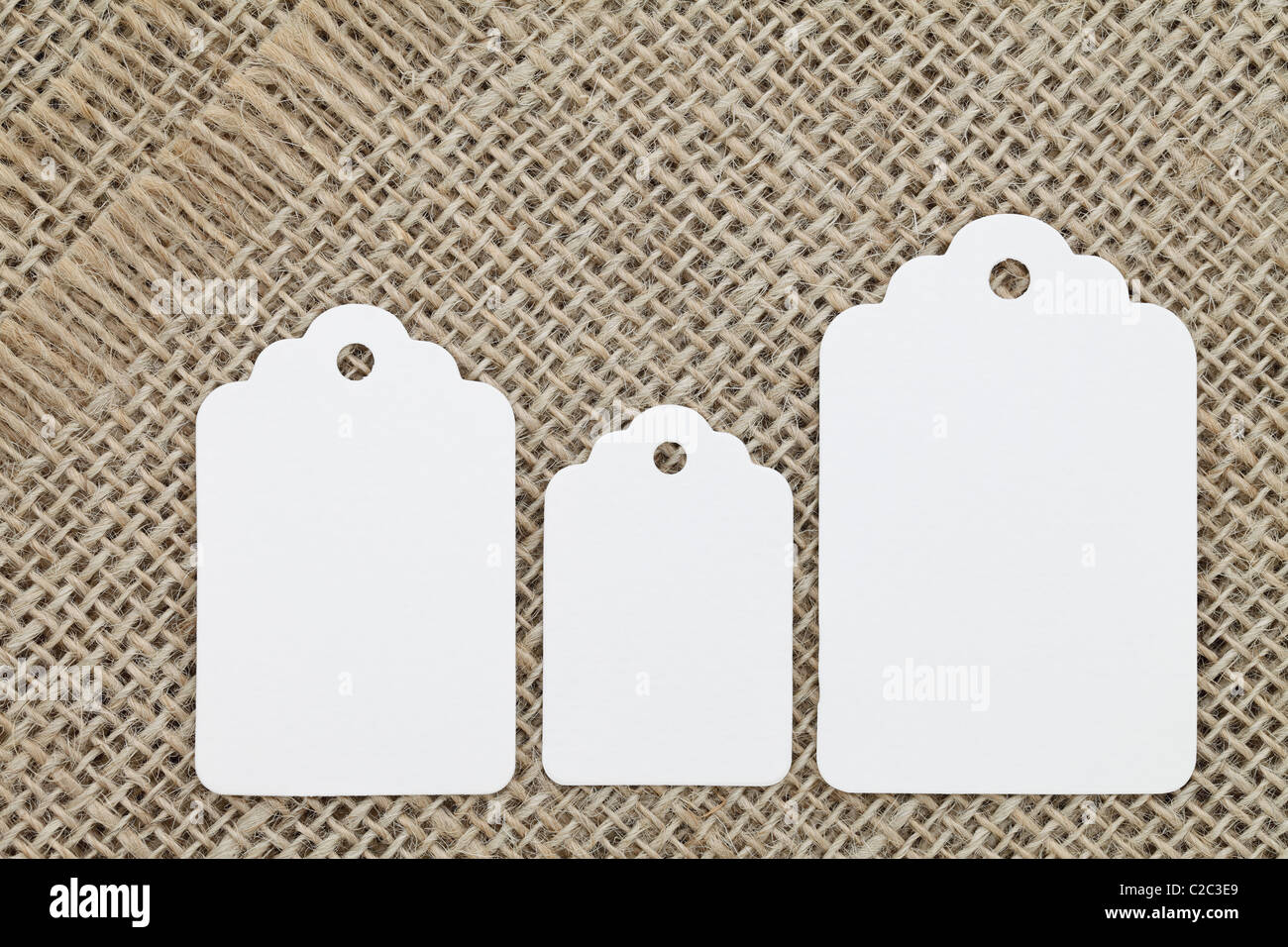 Blank labels on burlap background Stock Photo - Alamy