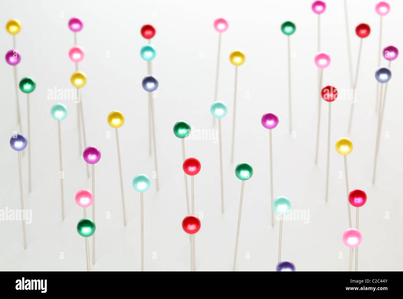 Colorful pins on gray background Stock Photo - Alamy