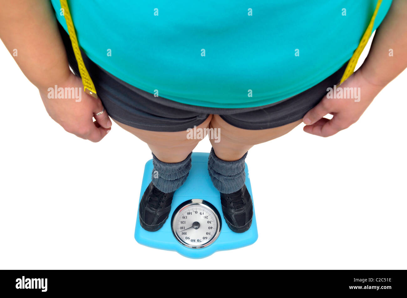 Woman's feet in a scale isolated in white Stock Photo - Alamy