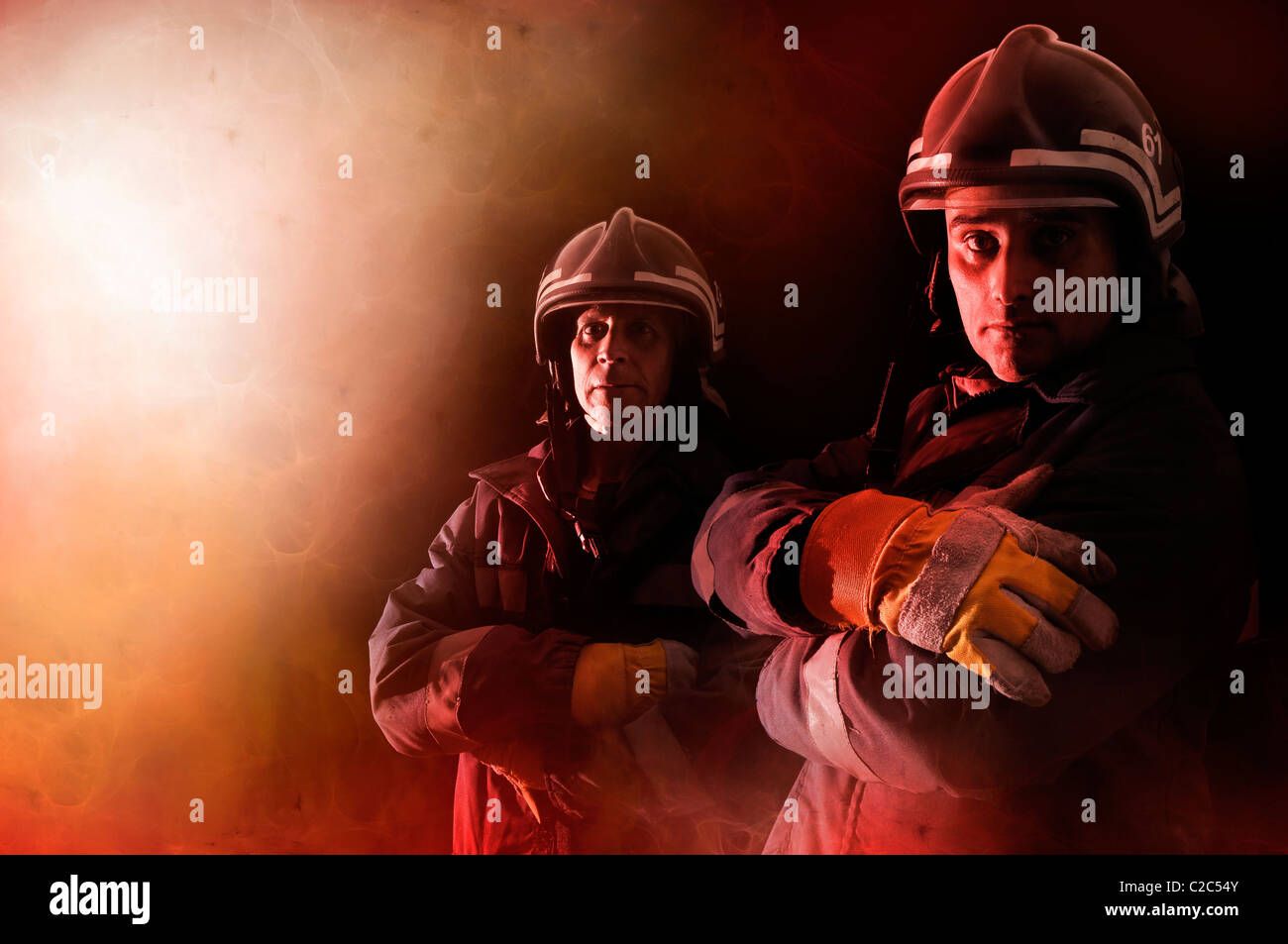 Dramatic image of firemen team in uniform Stock Photo - Alamy