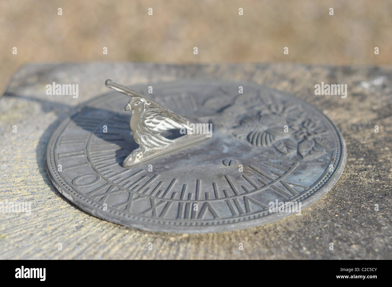 An image of a garden sundial shot at sunset Stock Photo - Alamy