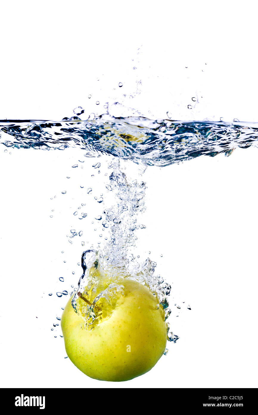 green apple splashing into water isolated on white background Stock ...