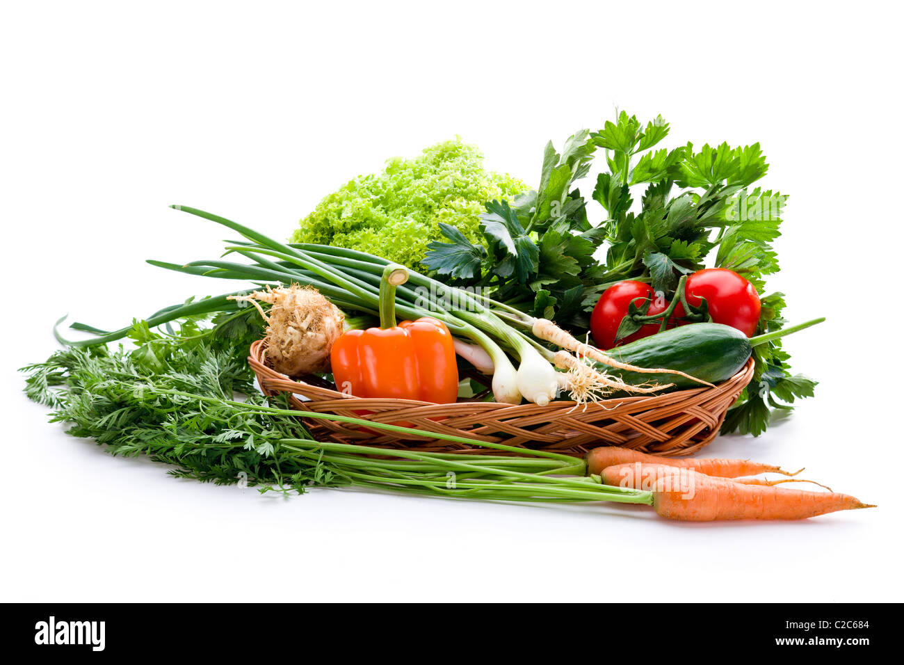 Organic vegetables in basket on white background Stock Photo - Alamy