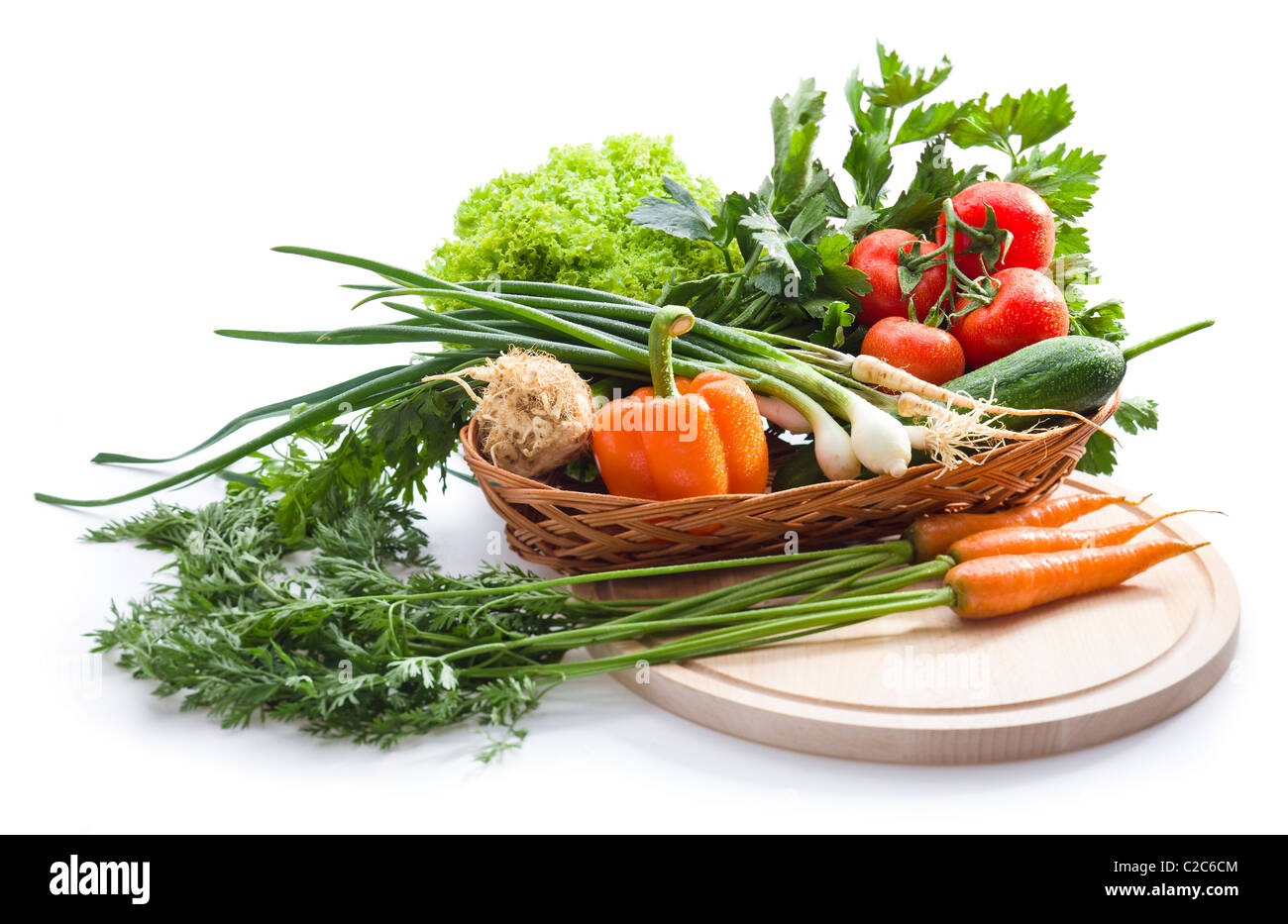 Organic vegetables in basket on white background Stock Photo - Alamy