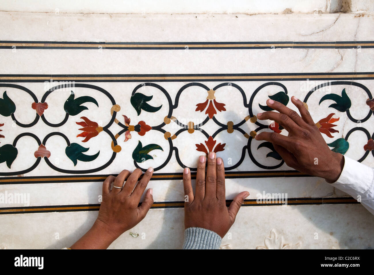 Visitors touch wall decorations of Taj Mahal in Agra, India Stock Photo ...
