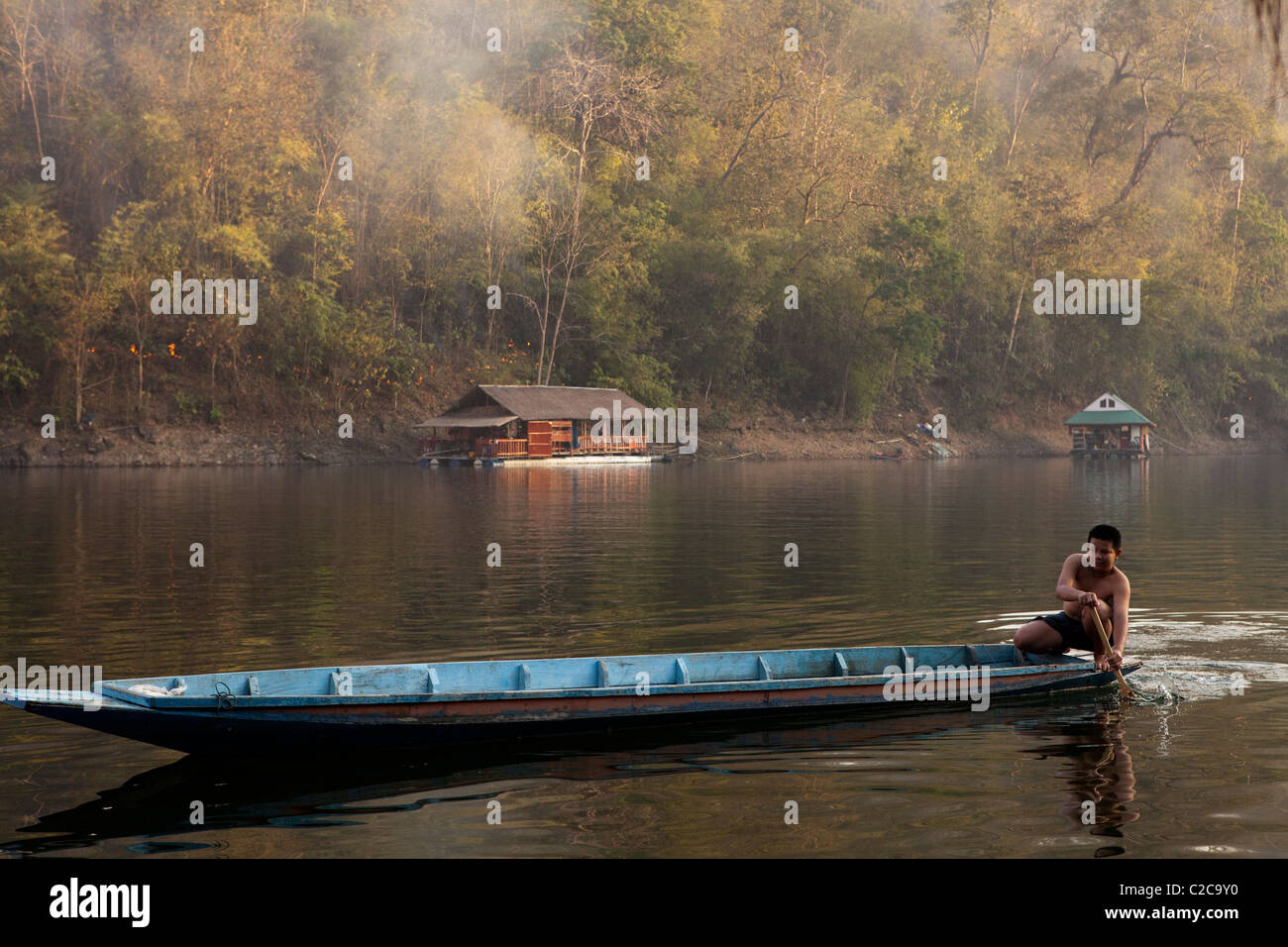 Boat man in Siam lake in Lampang, Thailand Stock Photo - Alamy