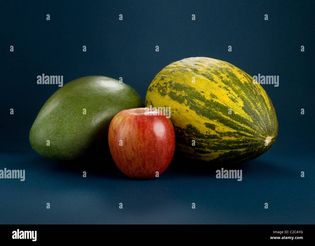 Selection of tropical fruits - mango, melon, apple Stock Photo - Alamy