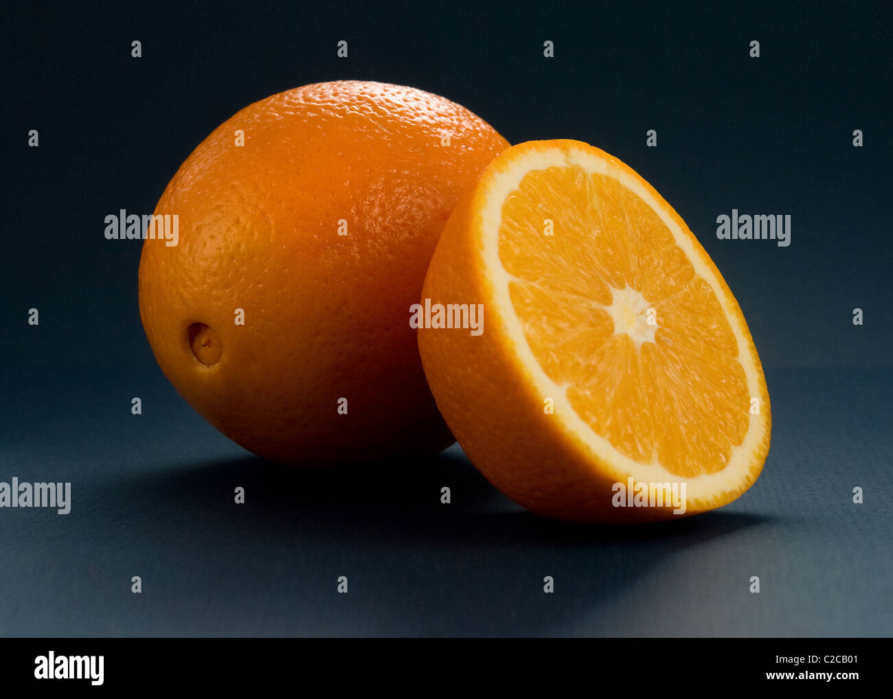 Fresh Delicious Orange - a full one and a half one Stock Photo - Alamy