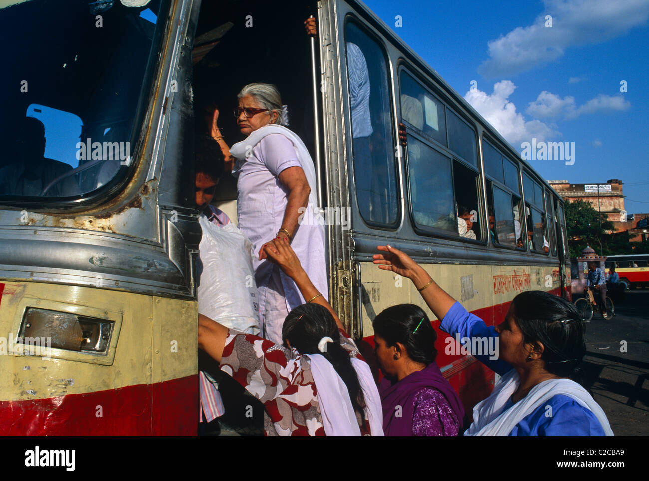 Old lady being helped onto packed bus, Jaipur, Rajasthan, India Stock ...