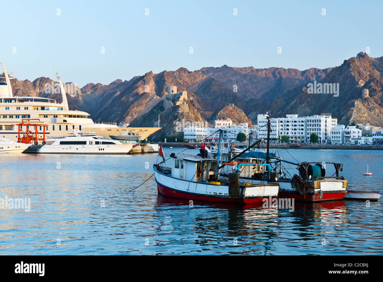 Boats anchored in the harbor of Muscat, Oman Stock Photo - Alamy