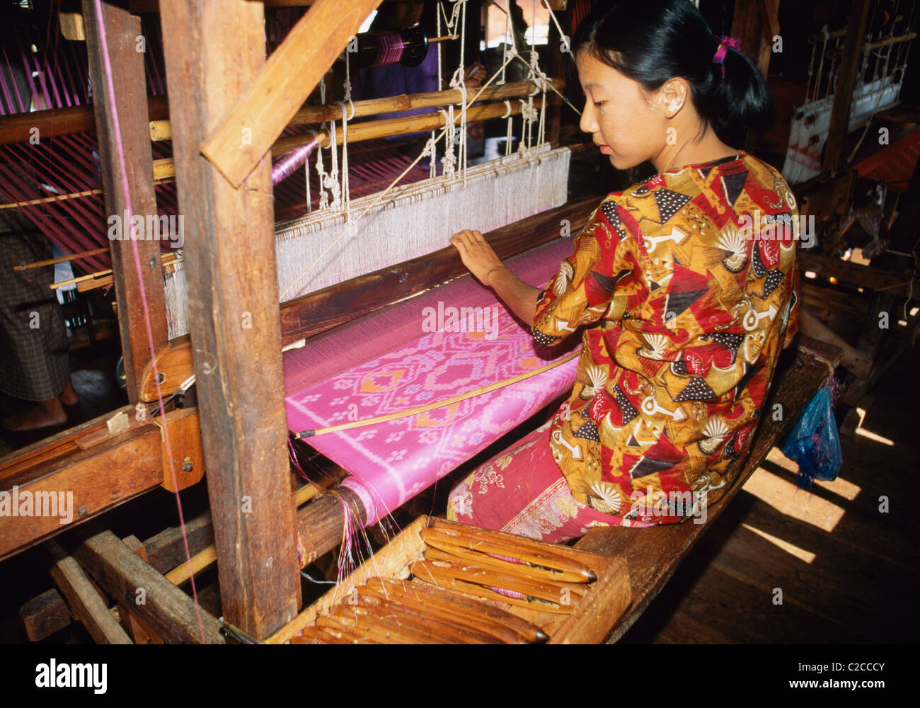 Woman weaving, Textile factory, near Ywama, Lake Inle, Shan State ...