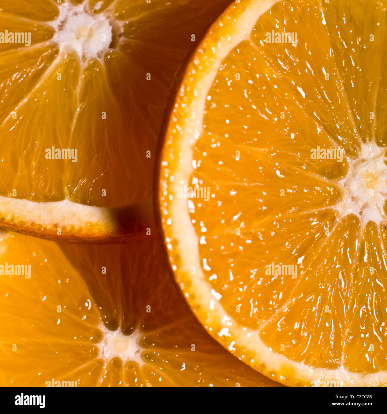 Three orange slices piled on top of each other Stock Photo - Alamy