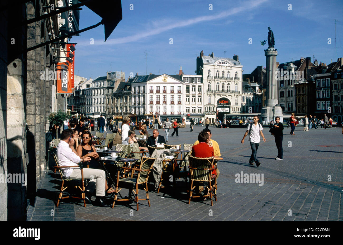 People sat at cafe in Grande Place, the main square in Lille ...