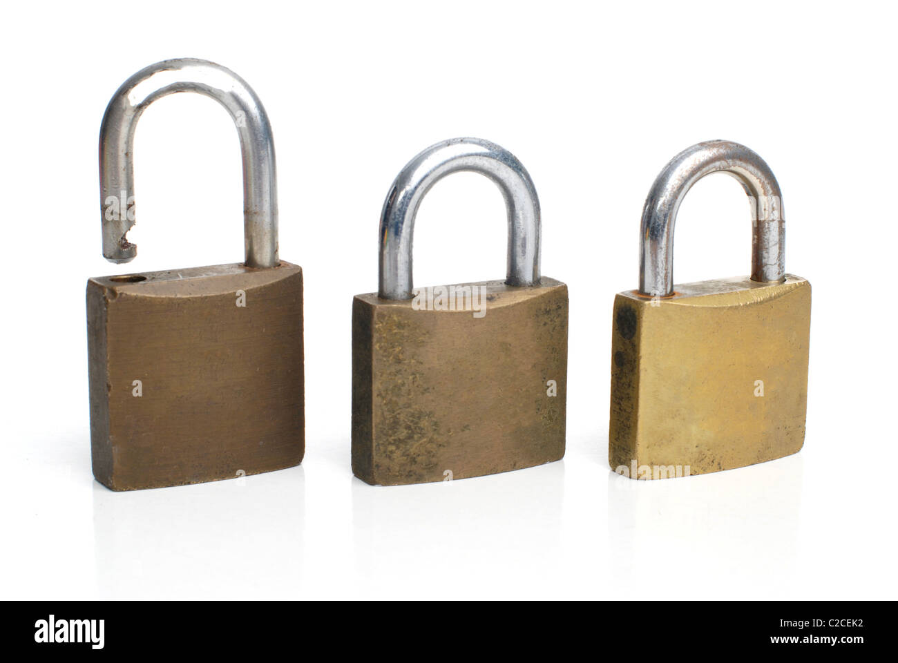 Three security gold locks in a row isolated on white background Stock ...