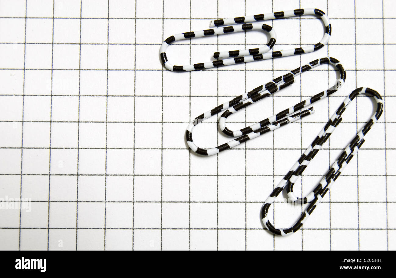 paper clip on the sheet of paper in a cell Stock Photo - Alamy