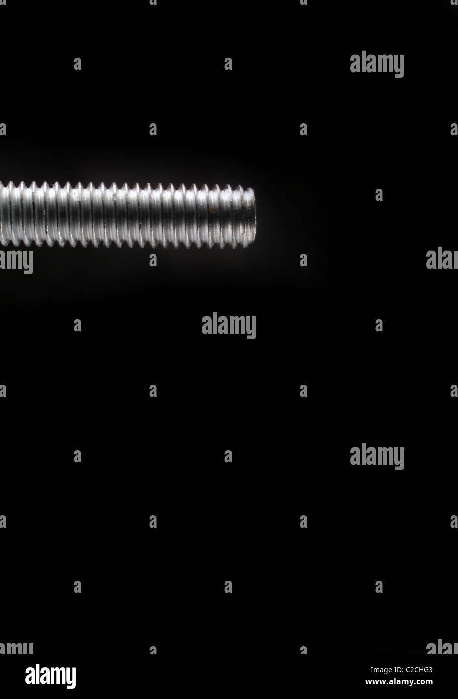 A screw-on a screw on a black background Stock Photo - Alamy