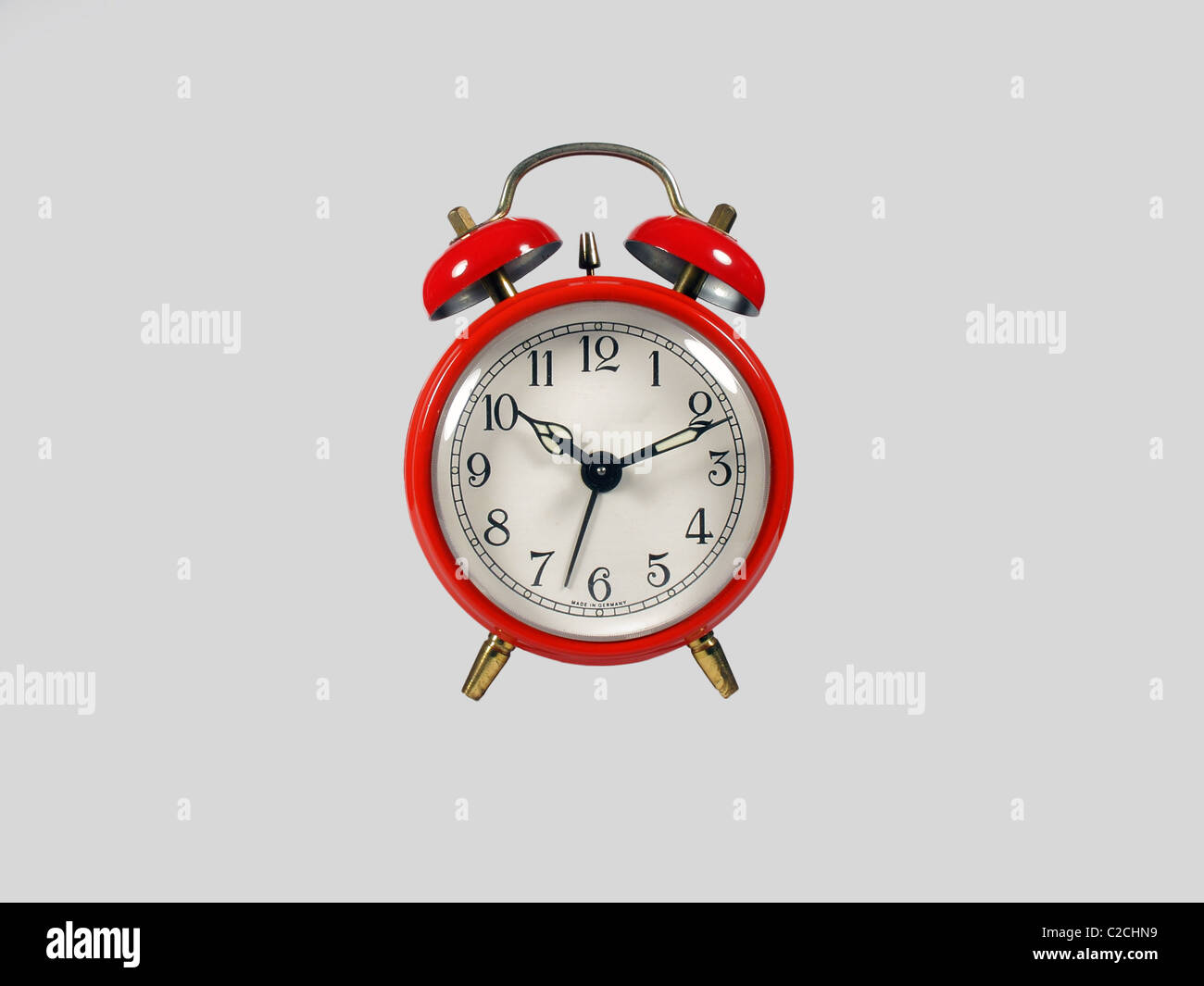 Old clock red on a white background Stock Photo - Alamy
