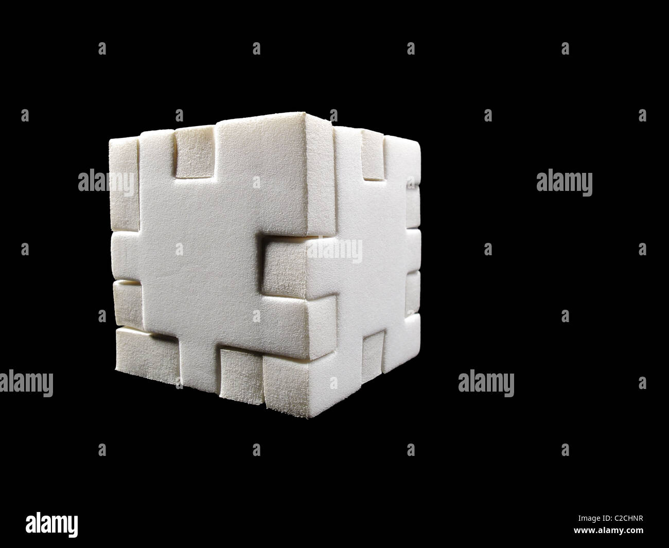 Puzzle cube white on a black background Stock Photo - Alamy