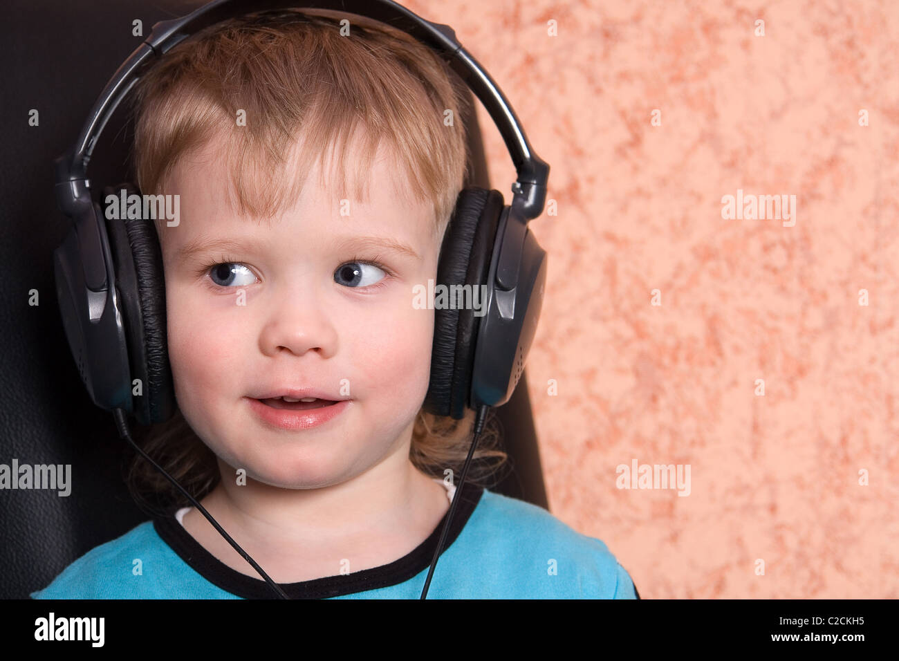 child in earphone listens music Stock Photo - Alamy