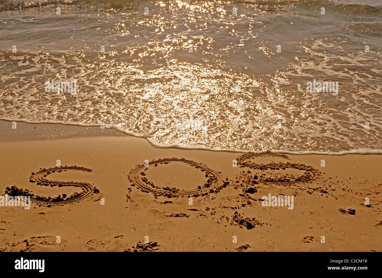 sos sign in the beach Stock Photo - Alamy