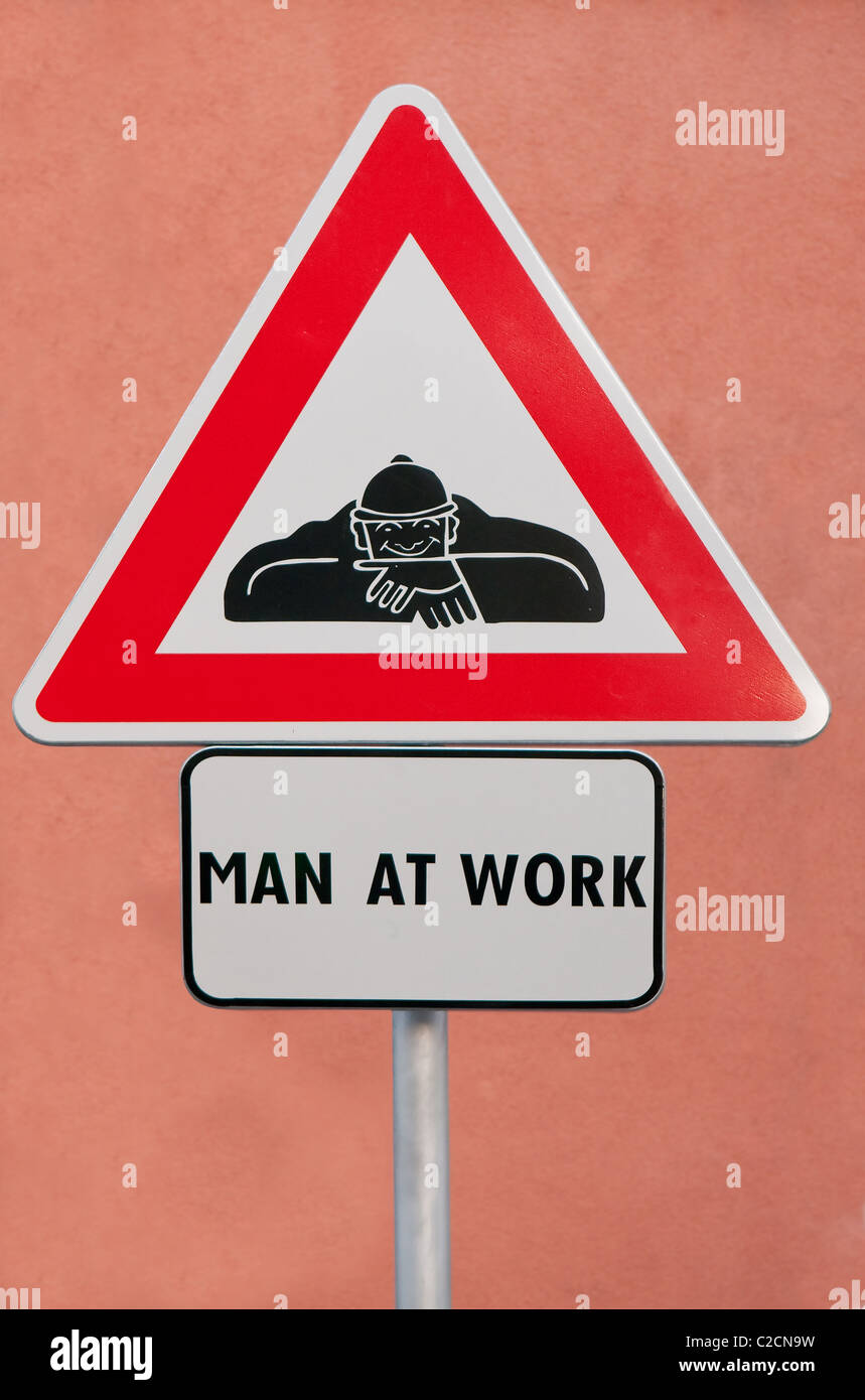 "MAN AT WORK" sign above famous Cumil sculpture in Bratislava, Slovakia ...