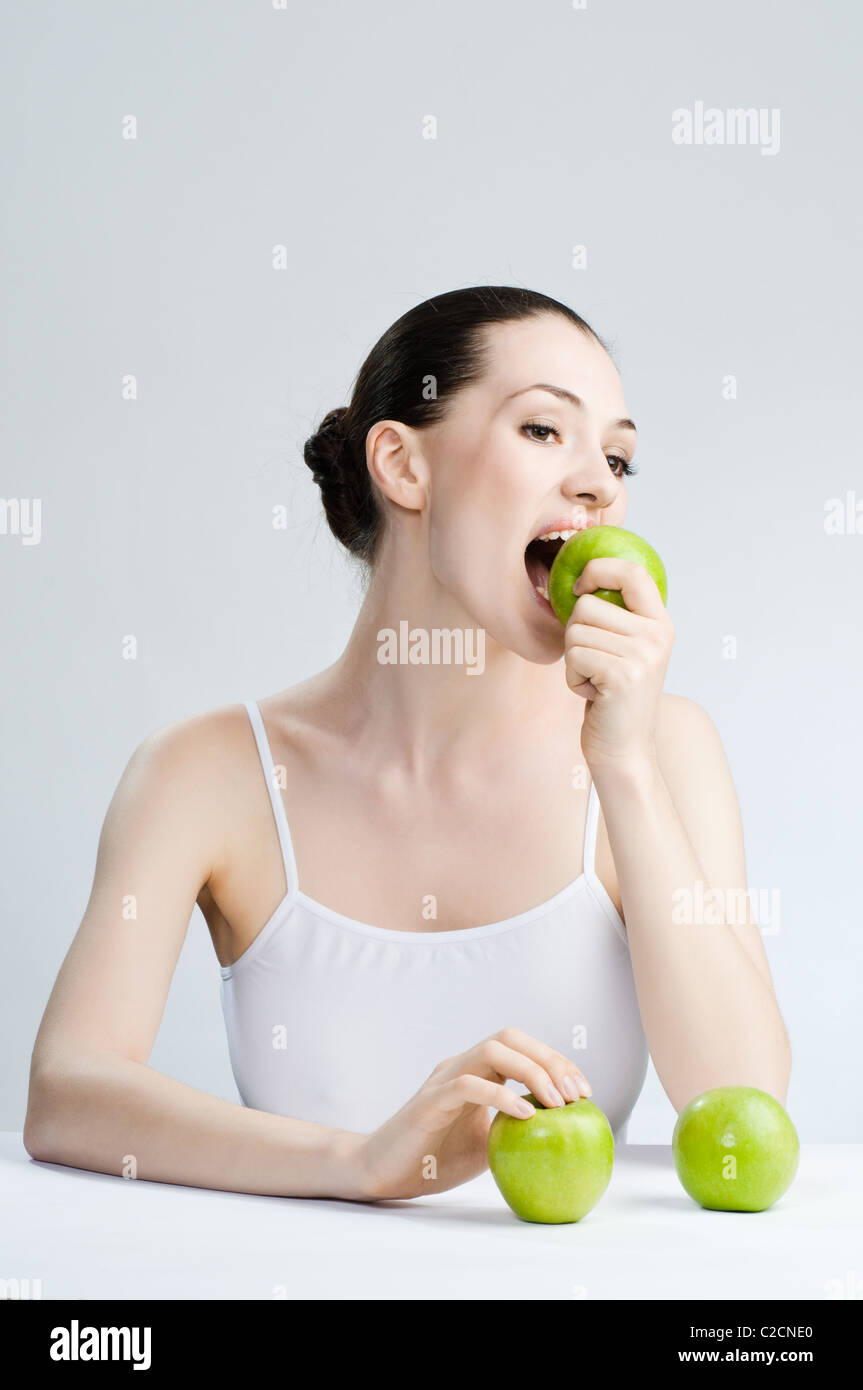 A beautiful slender girl eating healthy food Stock Photo - Alamy