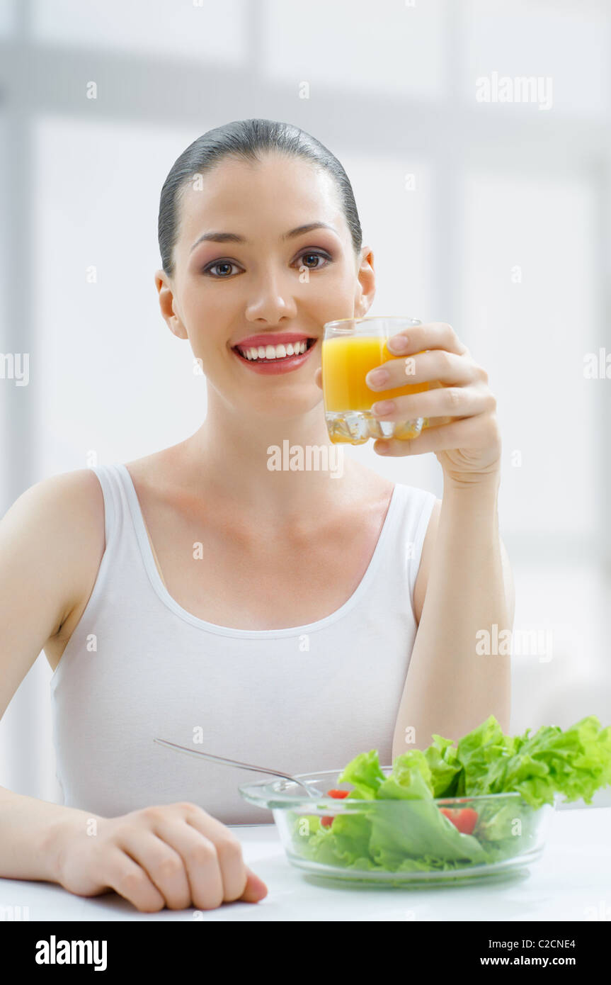 A beautiful slender girl eating healthy food Stock Photo - Alamy
