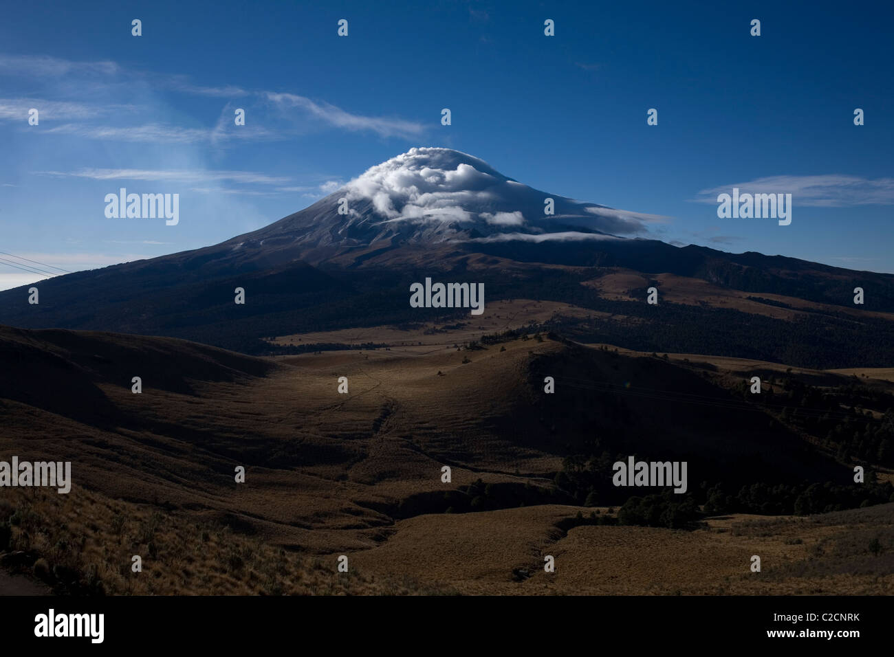 View of the Popocatepetl volcano covered by clouds in a picture taken ...