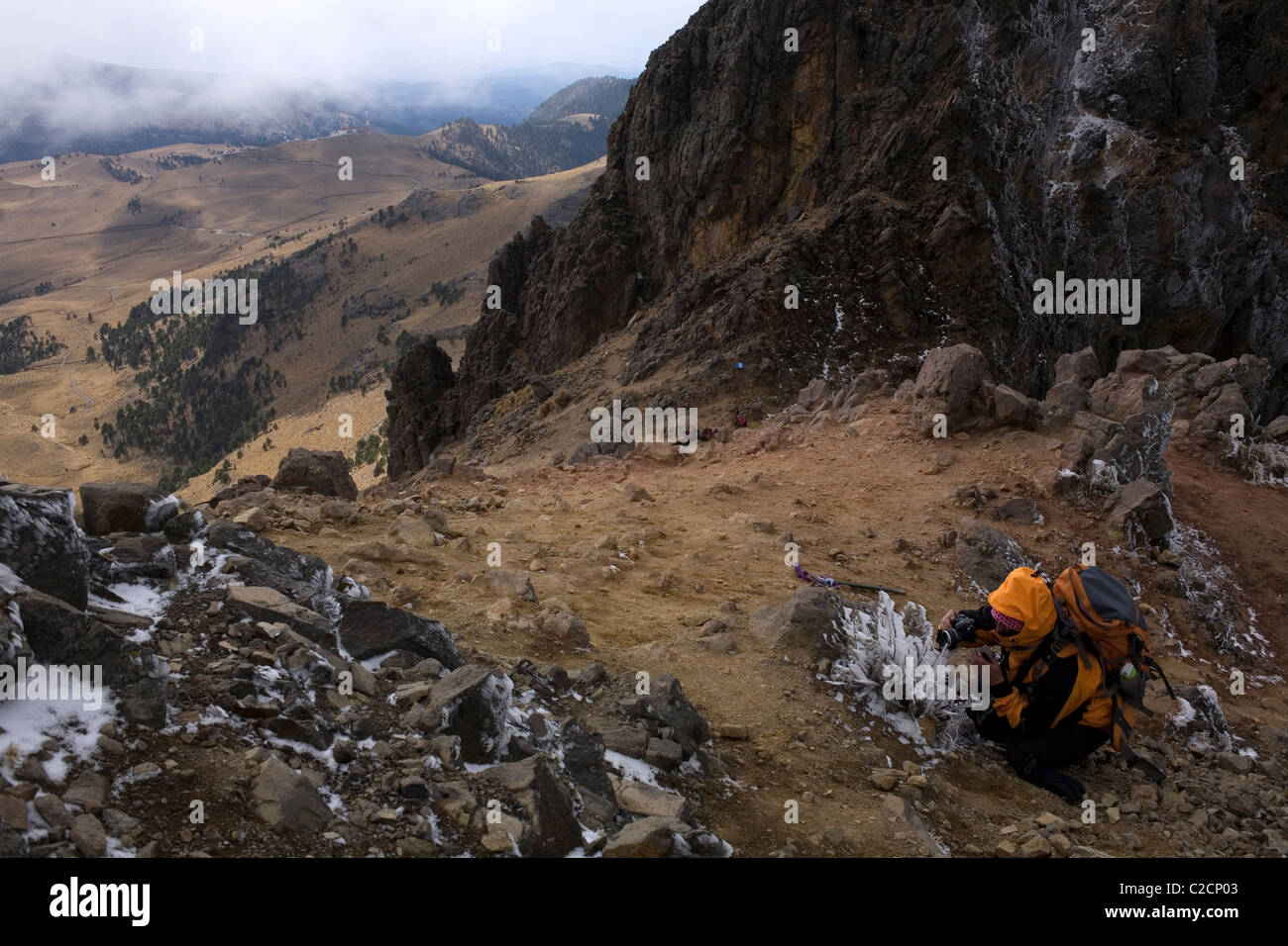A touches ice during a trekking trip to the Volcano "Ixta" in the ...