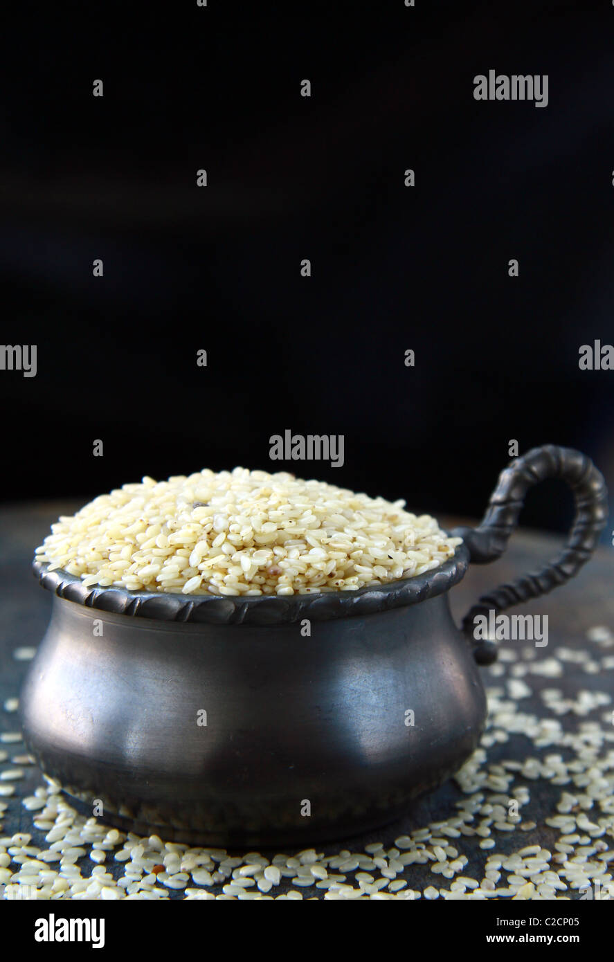 Close up of sesame seeds on a wood table Stock Photo - Alamy