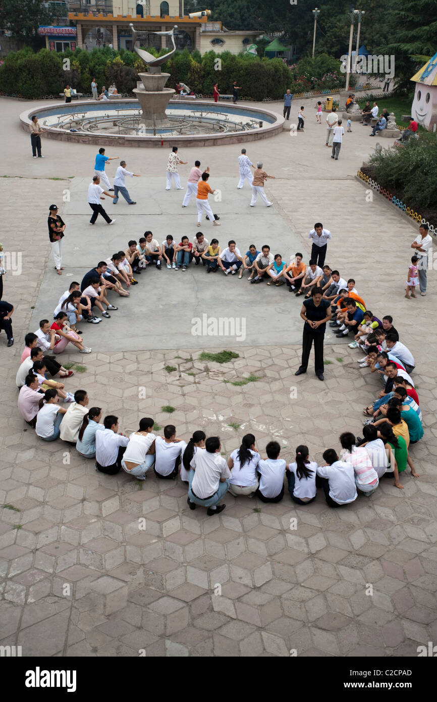 Young Chinese form a circle in a park in Gansu, China Stock Photo - Alamy