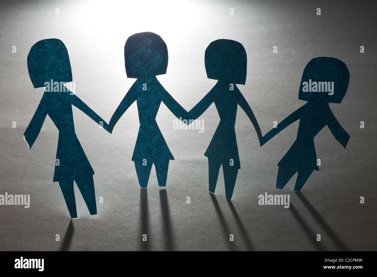 Paper Chain Women, concept of Teamwork Stock Photo - Alamy