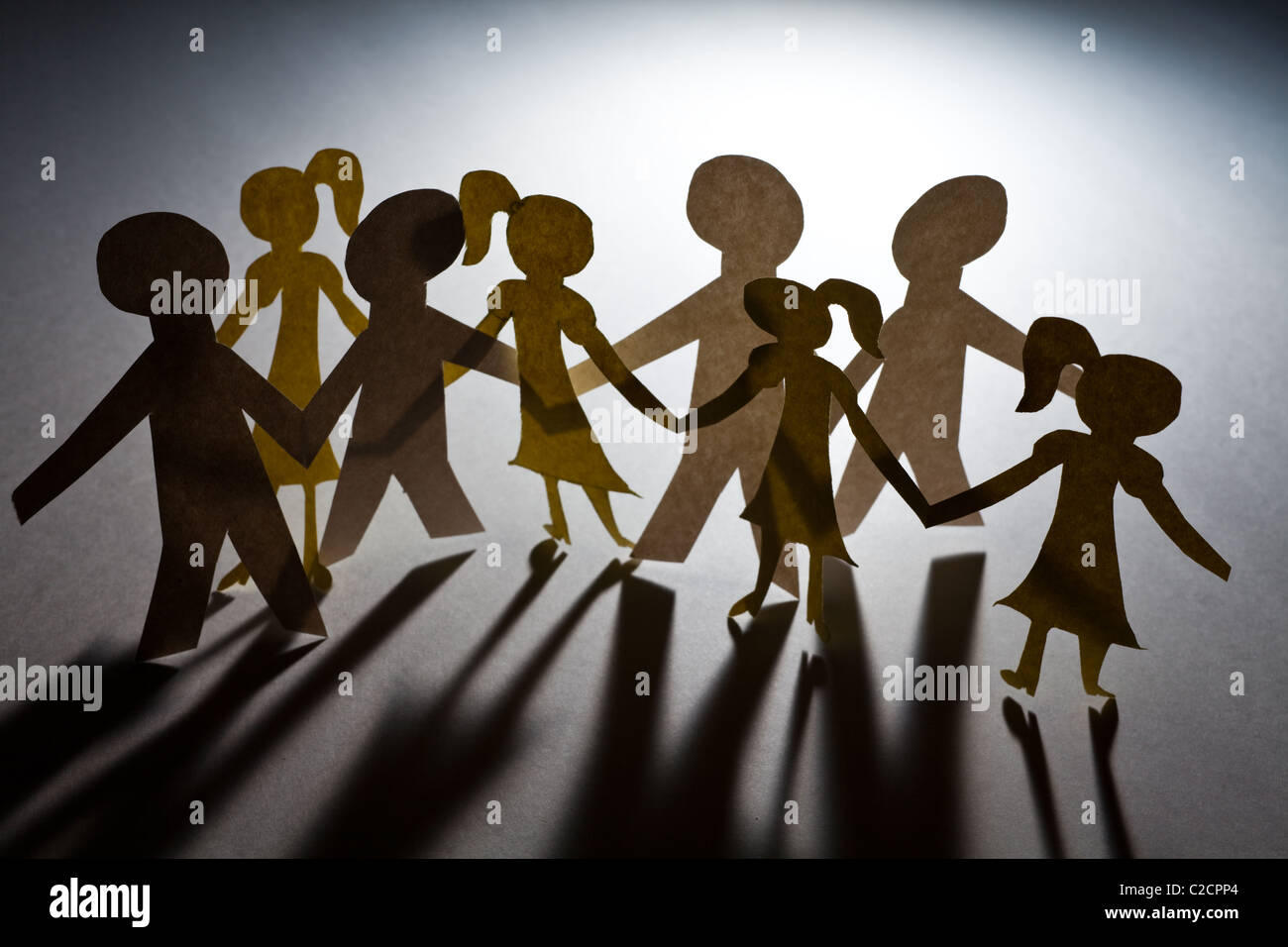 Paper Chain girls and boys, concept of Teamwork Stock Photo - Alamy