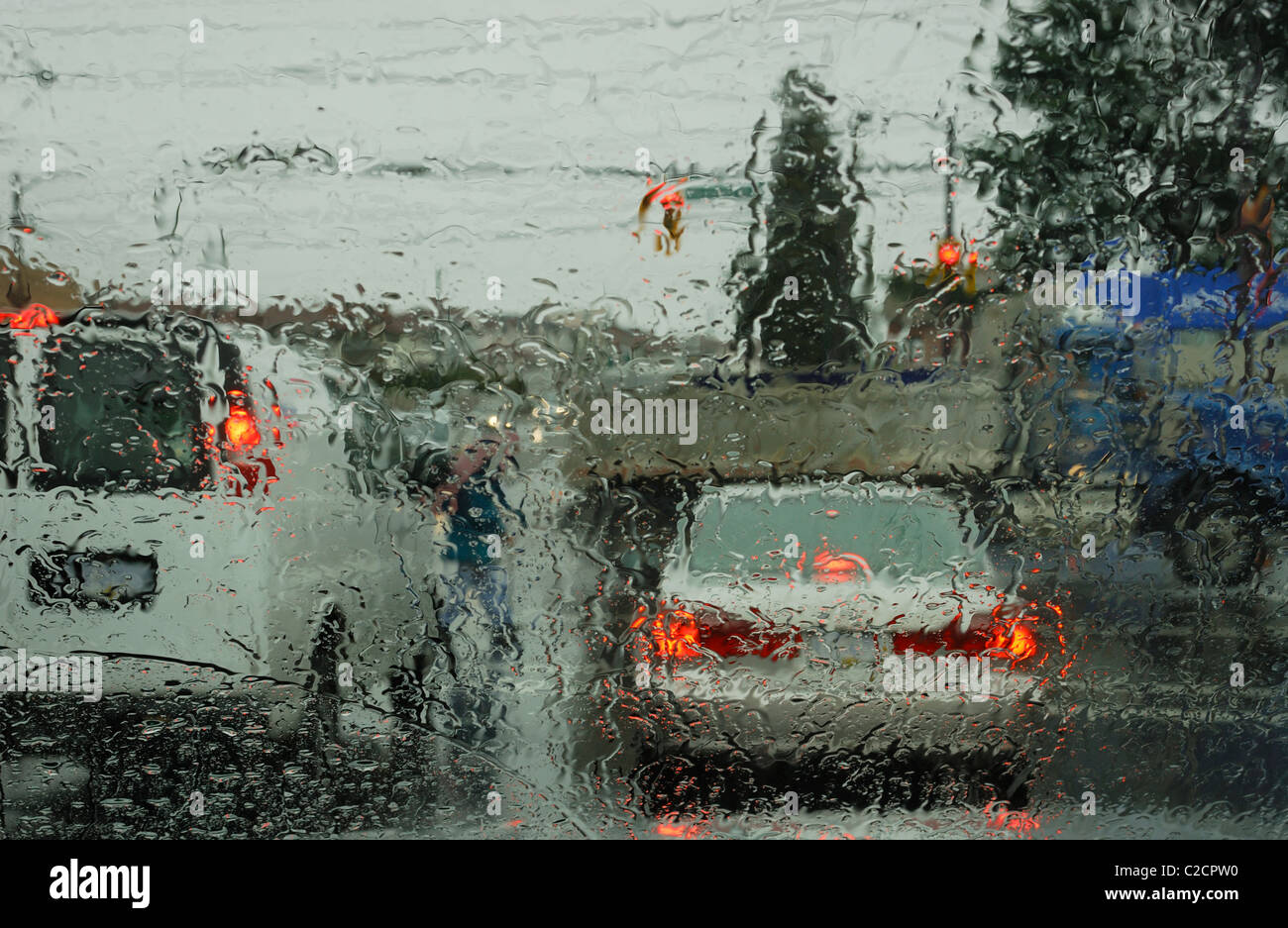 Looking at traffic through a rain covered windshield Stock Photo - Alamy