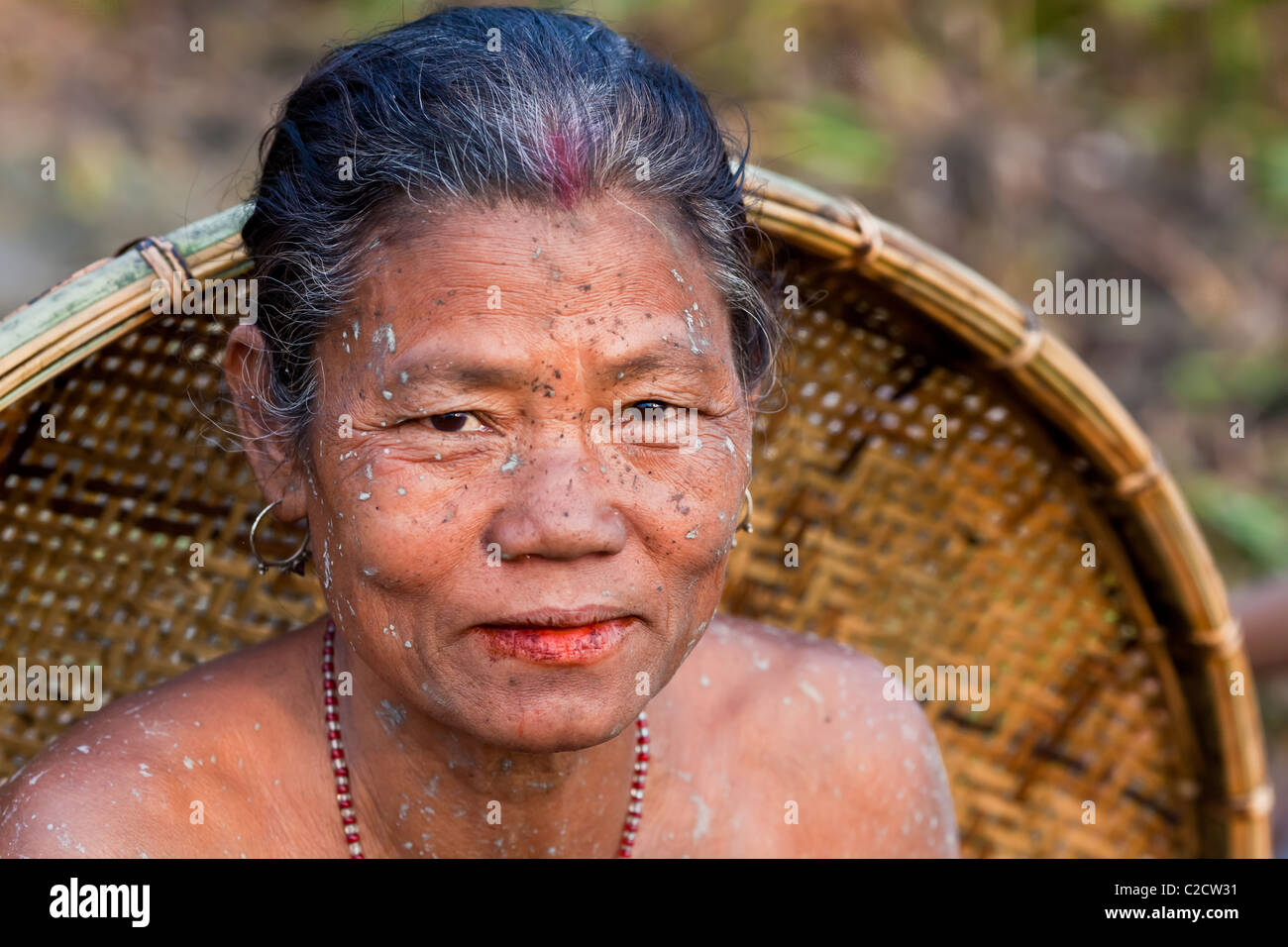 Portrait of elderly woman from the Mishing tribe, Majuli Island, Brahmaputra river, Assam, India ...