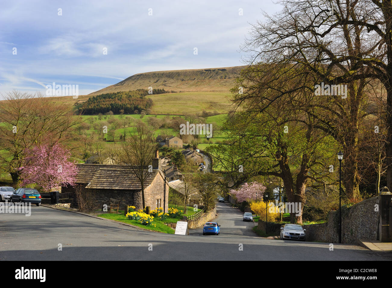 Downham in spring with Pendle Hill beyond Stock Photo - Alamy