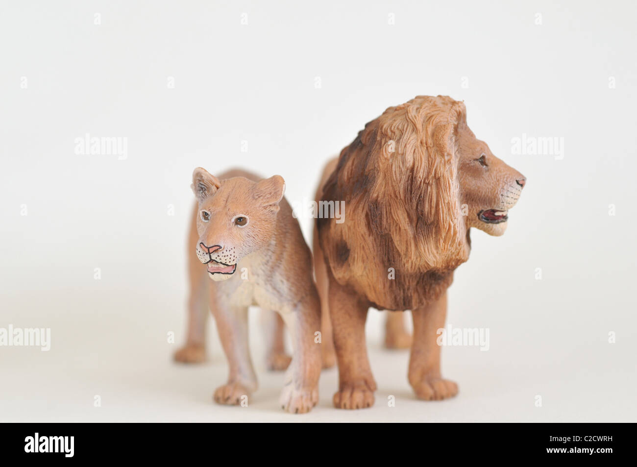 Wild cats toys plastic figurine (lion, lioness Stock Photo - Alamy