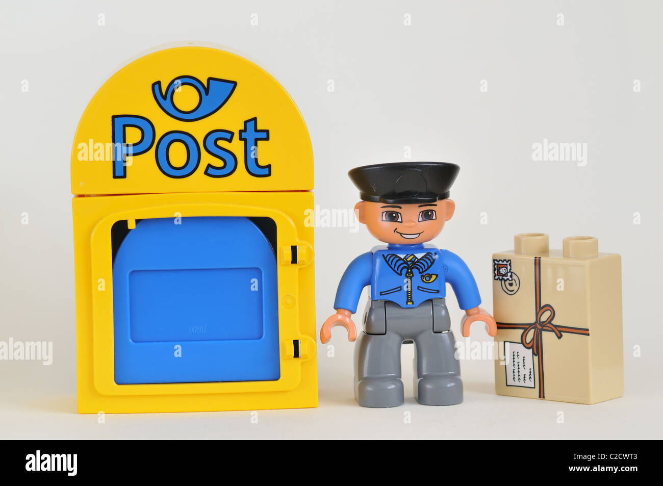 Lego postman delivering a letter to a postbox Stock Photo - Alamy