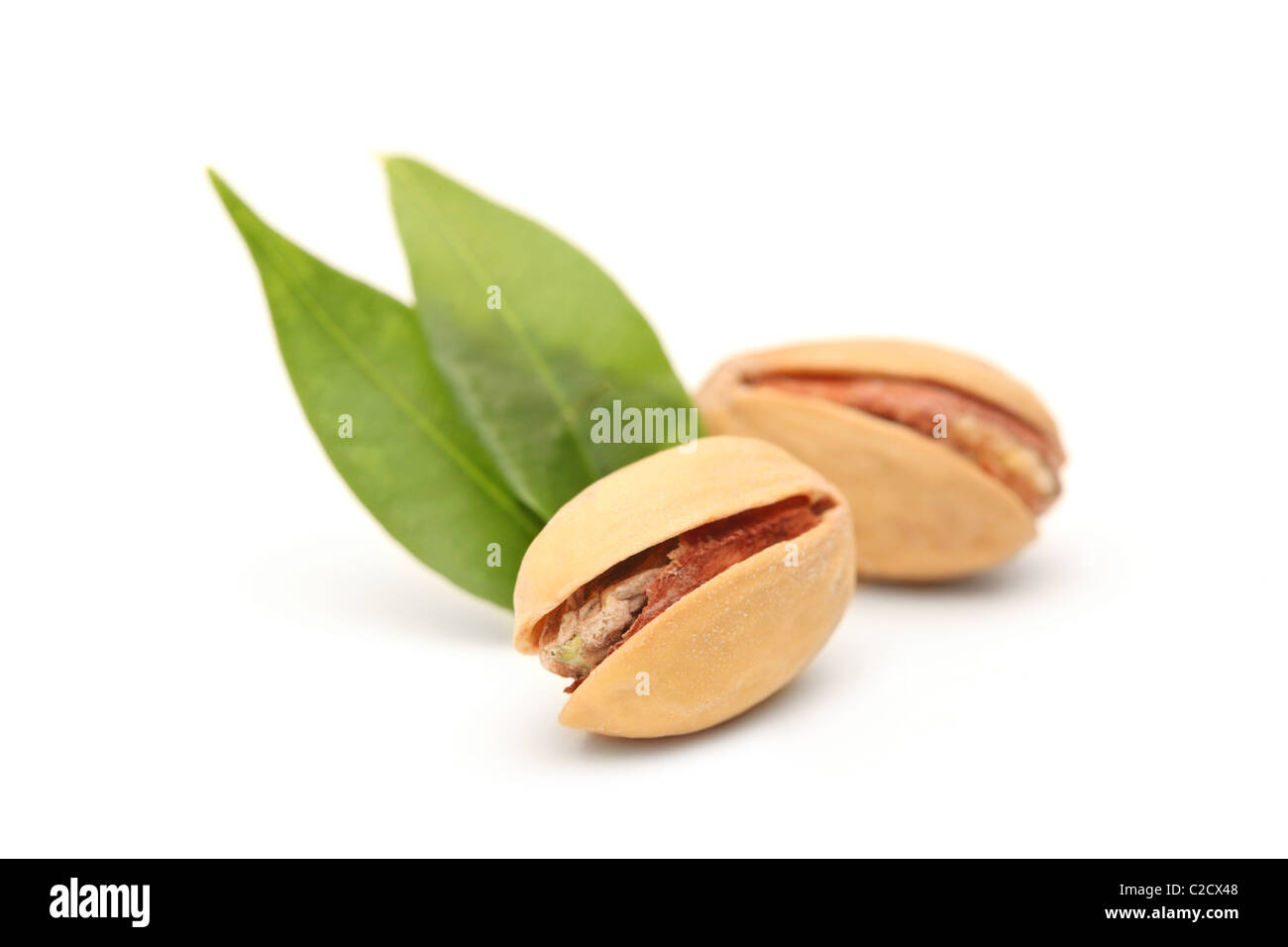 Pistachio nut with open nutshell Cut Out Stock Images & Pictures - Alamy