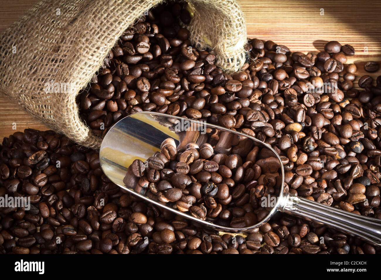 Sack with coffee beans on old plank Stock Photo - Alamy