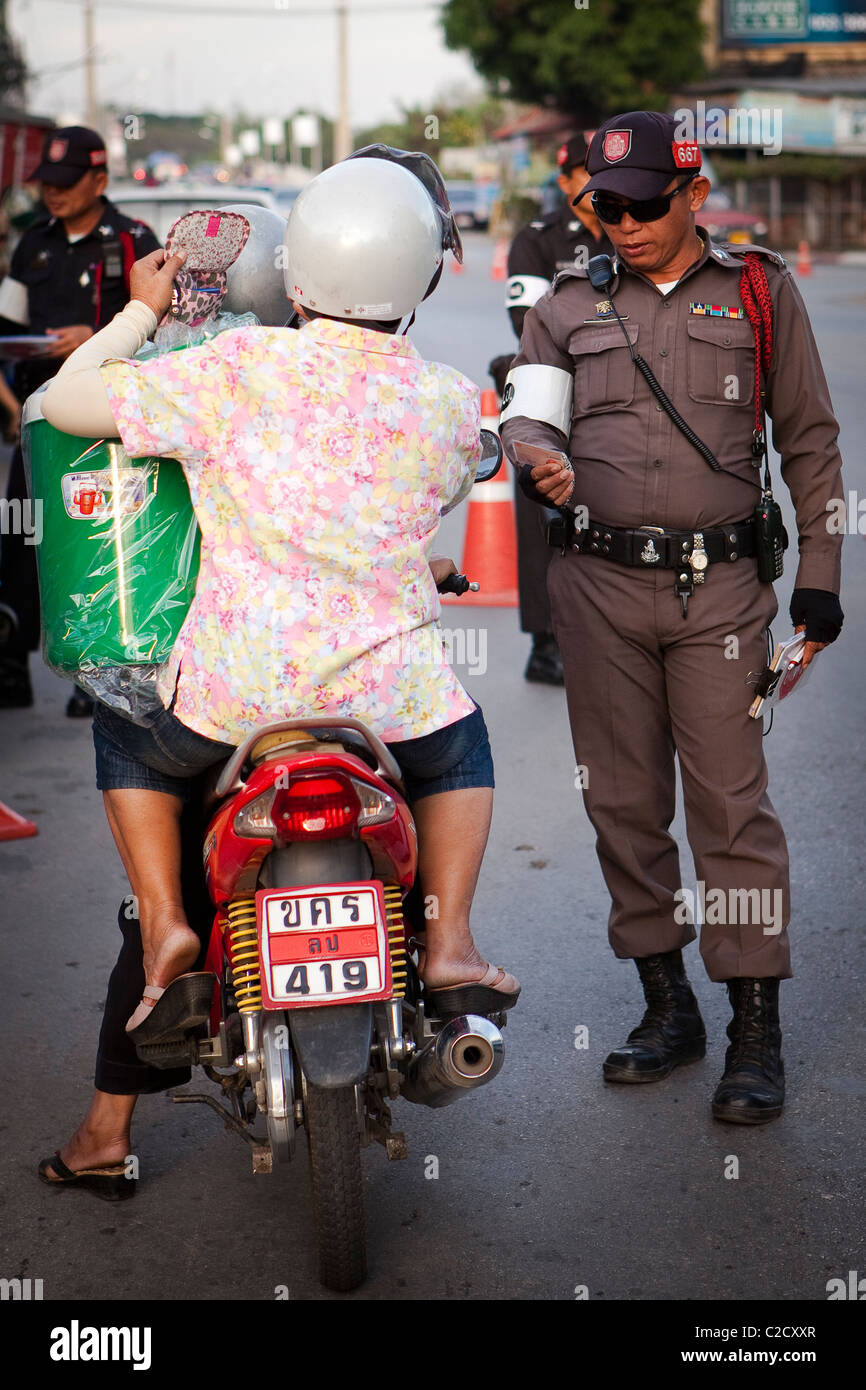 Thailand traffic police check the driving license with helmet and tax ...