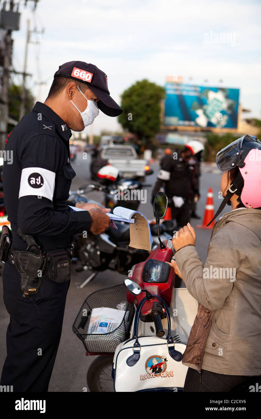 Thailand traffic police check the driving license with helmet and tax ...