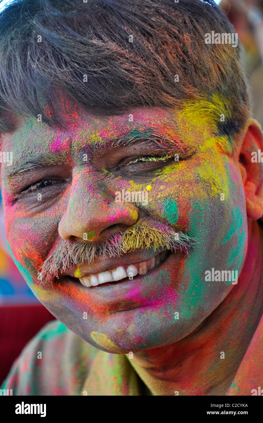 An Indian with multiple colours on his face Stock Photo - Alamy