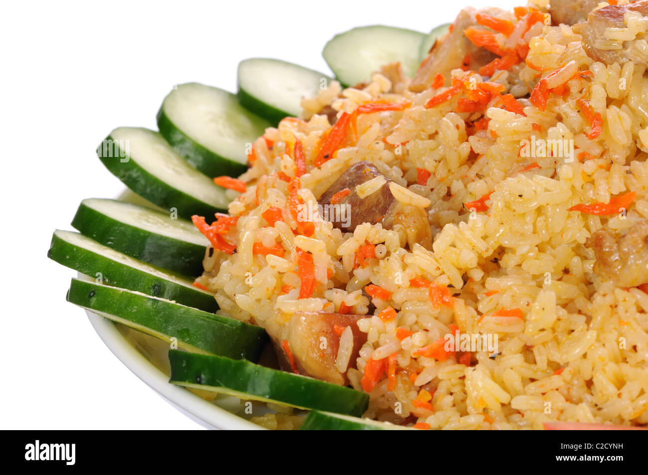 Rice with meat on a plate isolated on white background Stock Photo - Alamy
