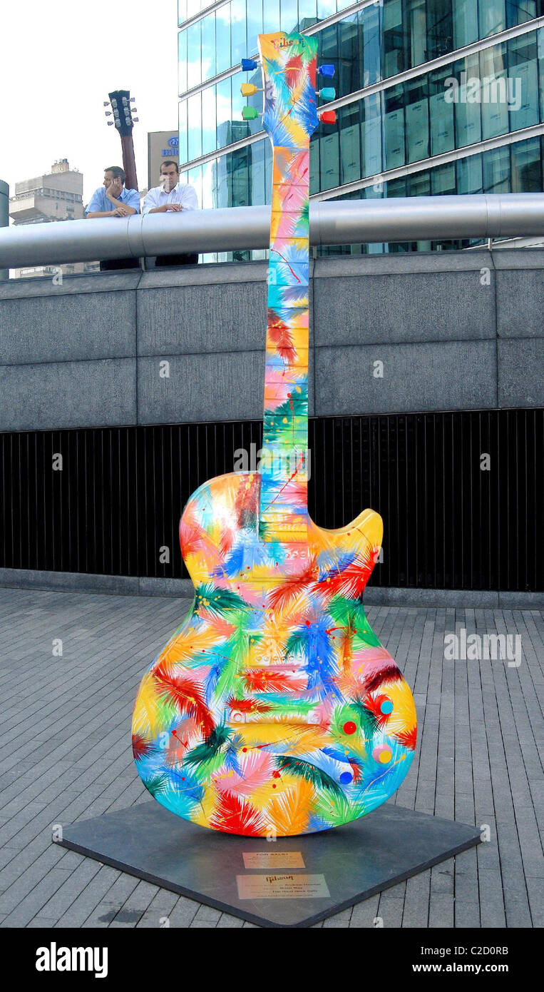 Brian May signs a ten foot Gibson Les Paul Guitar as part of the Gibson ...