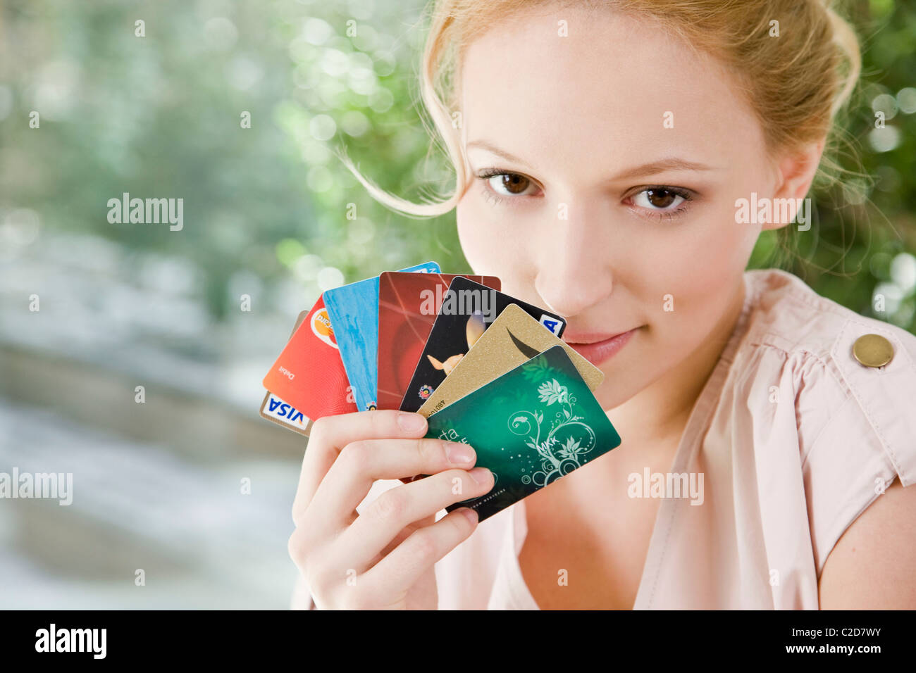 Female fan of credit cards hi-res stock photography and images - Alamy