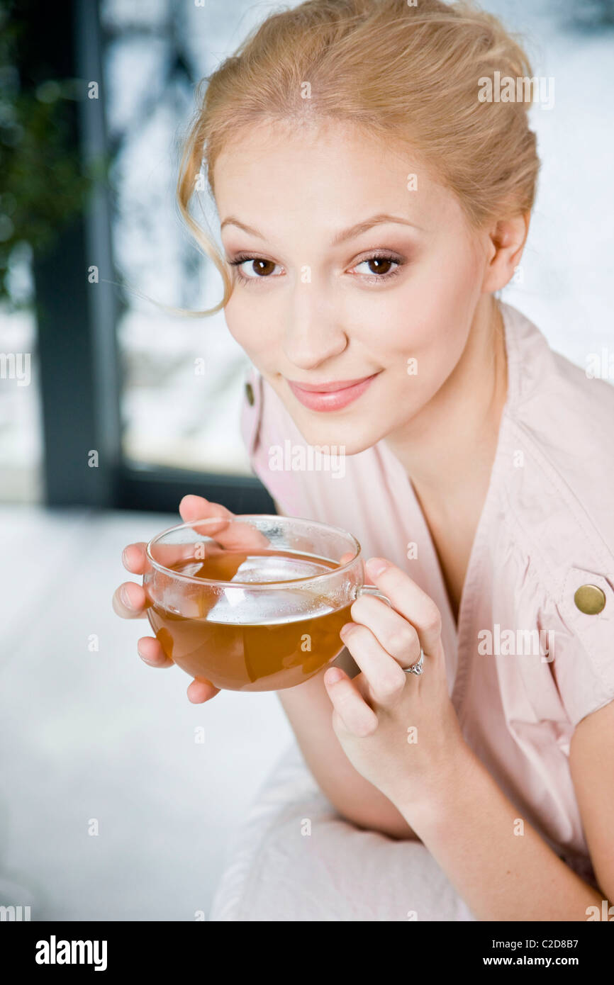 Woman green tea eye contact hi-res stock photography and images - Alamy